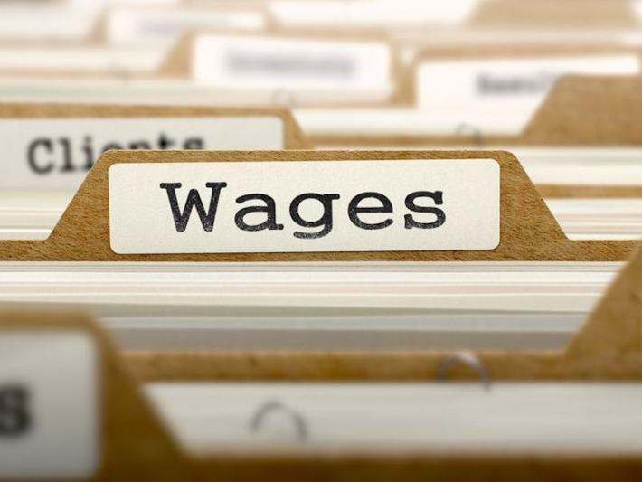 What does the term wage in Code of wages Act, 2019 mean?